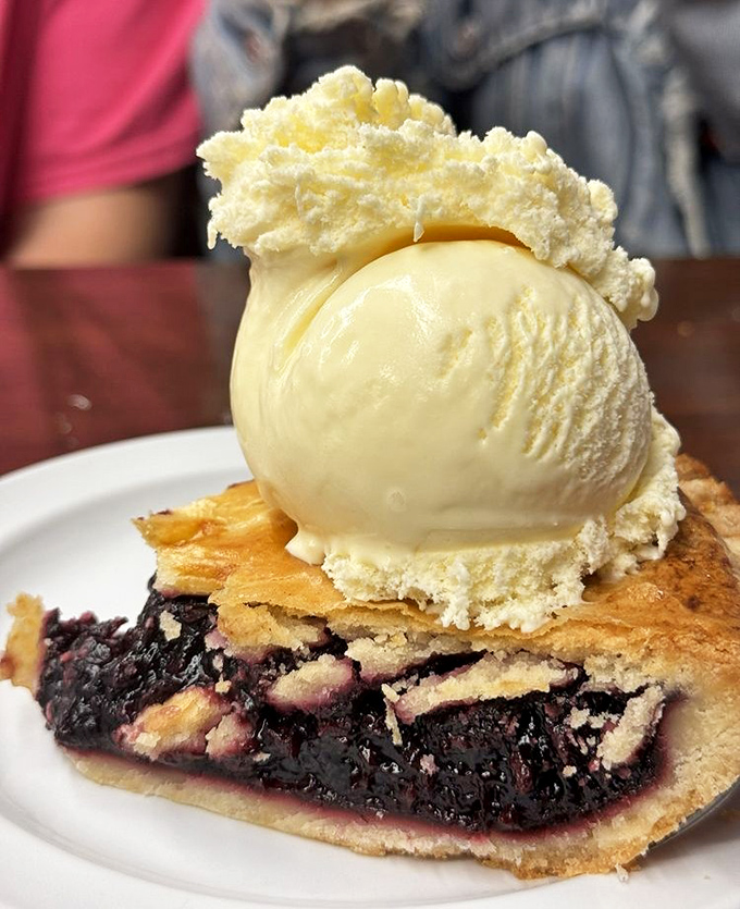 Boysenberry pie with ice cream: proof that dessert isn't just a course, it's a constitutional right that should be exercised regularly and with enthusiasm.