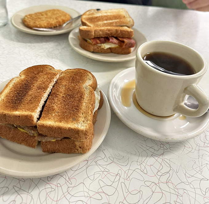 Breakfast sandwiches that laugh at your fancy avocado toast. Golden-grilled bread hugging eggs and meat&mdash;the morning fuel of champions.
