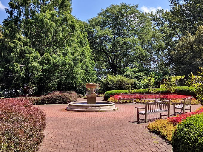 A brick plaza with thoughtfully placed benches invites visitors to sit awhile&mdash;because sometimes the best garden activity is simply doing nothing at all.