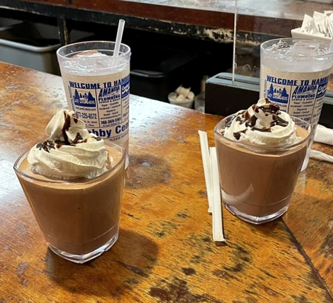 Milkshakes thick enough to require serious straw commitment. These chocolate treasures topped with whipped cream are dessert masquerading as a beverage—and nobody's complaining.