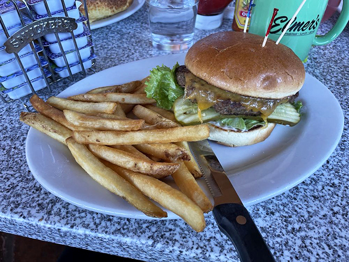 Burger philosophy 101: Perfect meat-to-bun ratio, proper melt on the cheese, and fries that stand at attention like they're auditioning for a food magazine.
