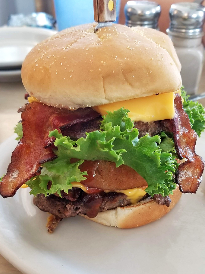 A burger that requires jaw exercises before attempting. Those bacon strips aren't ingredients&mdash;they're statements of purpose.