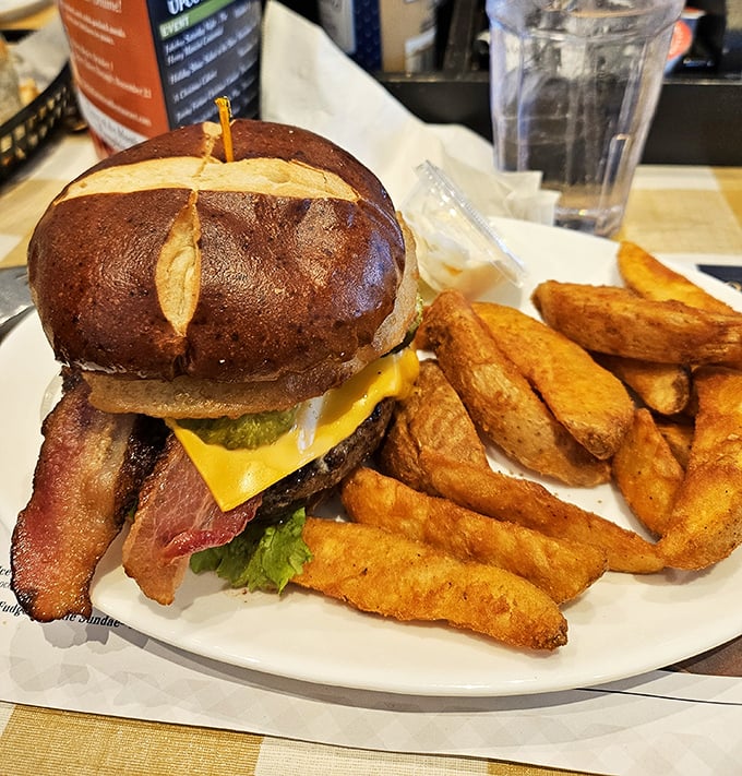 This isn't just a burger&mdash;it's a skyscraper of flavor on a pretzel bun with fries so perfectly golden they deserve their own Instagram account.