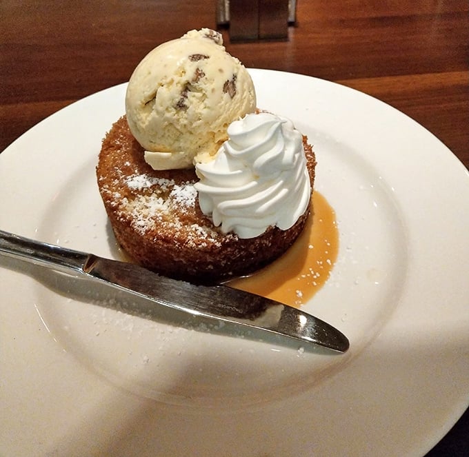 The butter cake arrives like a warm hug on a plate. That scoop of ice cream slowly melting on top is nature's perfect timing.