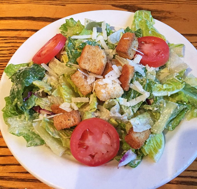 A Caesar salad that actually deserves its imperial name &ndash; crisp romaine, house-made croutons, and parmesan that wasn't born in a green can.