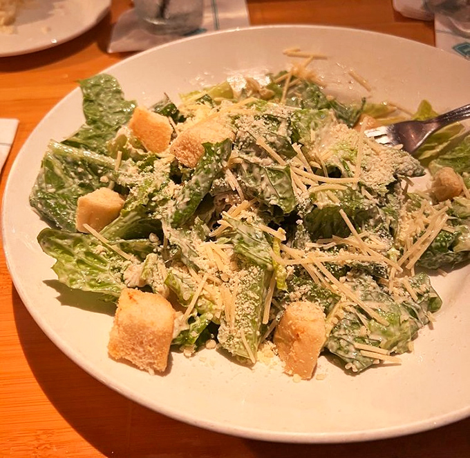 Even Caesar would bow to this salad – crisp romaine, generous parmesan, and house-made croutons that crackle with each delightful bite.