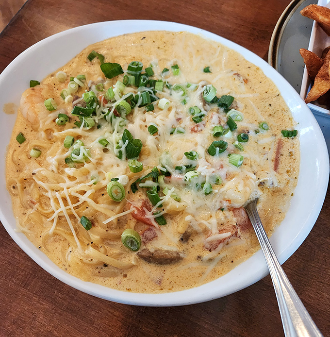 Creamy pasta nirvana with green onions standing by as lifeguards &ndash; dive in and prepare to be happily lost in this cajun carbonara sea.