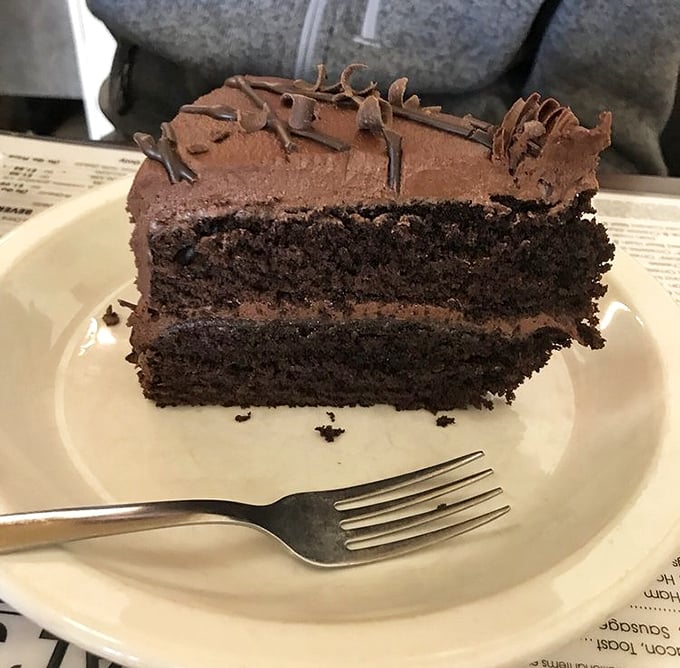 Chocolate cake so rich it probably owns real estate in several states. Not just dessert—it's what other desserts aspire to be when they grow up.