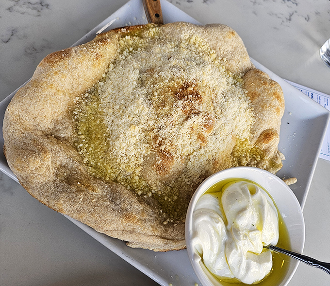 Not just bread &ndash; a pillowy cloud of dough transformed into a vessel for what appears to be the creamiest ricotta this side of Naples.