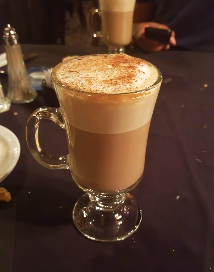 A proper cappuccino with a dusting of cinnamon &ndash; the kind that makes you linger at the table long after the plates have been cleared.