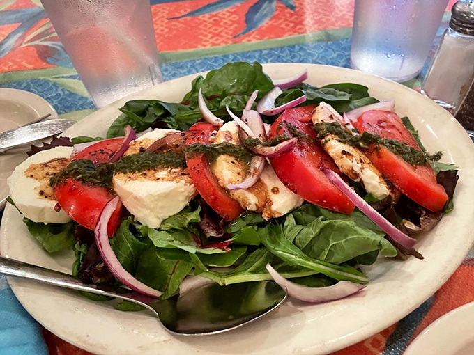 The caprese salad offers a refreshing interlude between seafood courses, like a palate-cleansing ocean breeze.