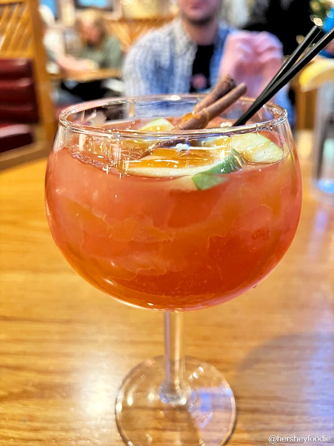 A cocktail that puts the "happy" in happy hour. This vibrant sangria brings orchard freshness to your maritime feast.