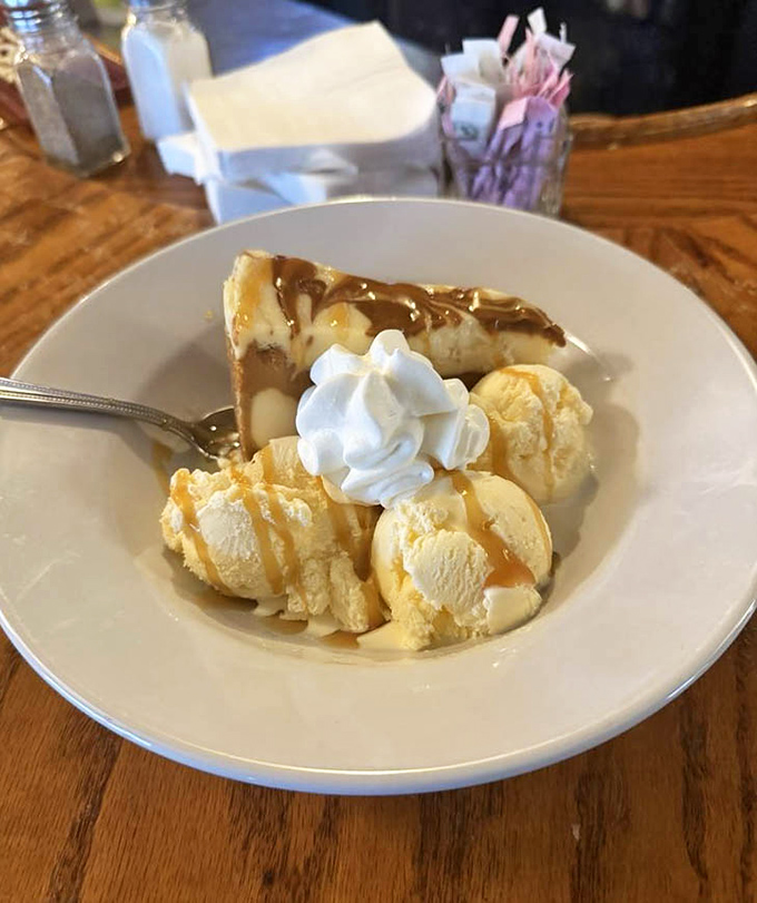Caramel cheesecake with vanilla ice cream&mdash;proof that the best relationships are sweet, rich, and slightly complicated.