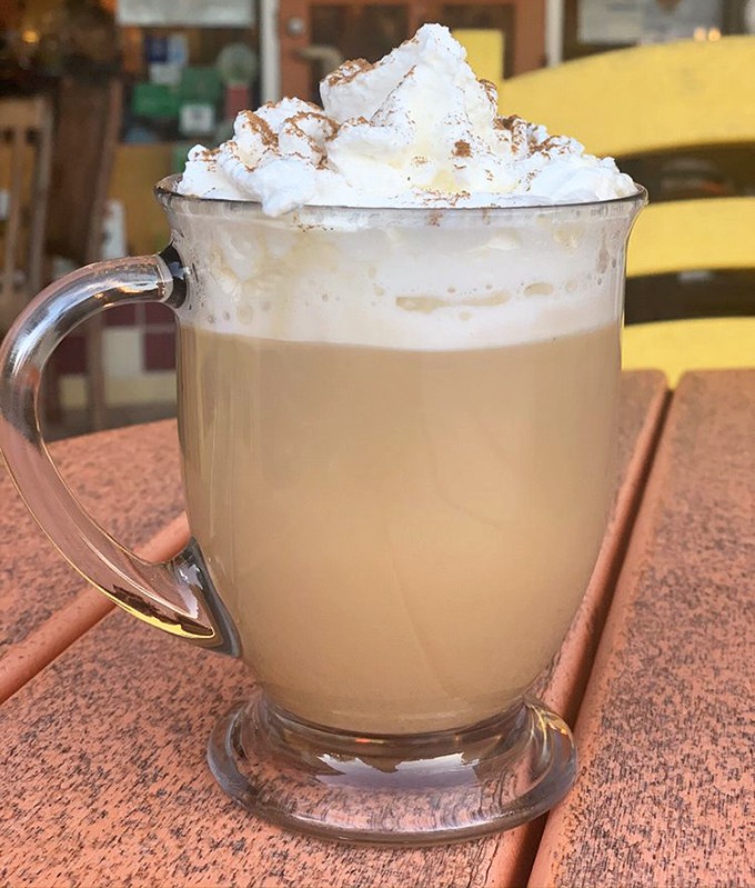Coffee elevated to an art form. This caramel latte topped with whipped cream isn't just a beverage&mdash;it's a warm hug in a glass mug.