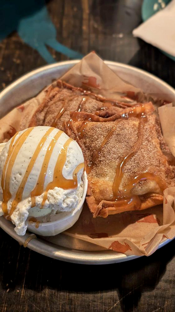 Dessert that makes you question your life choices&mdash;warm apple pie pastry with ice cream and caramel that's worth saving room for.