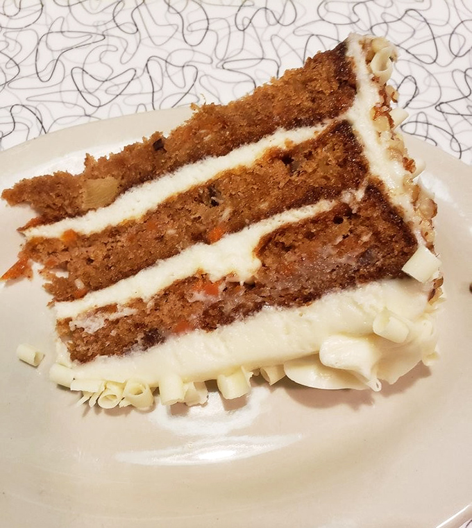This carrot cake isn't just dessert; it's three layers of sweet closure to a savory meal, with cream cheese frosting as the perfect encore.