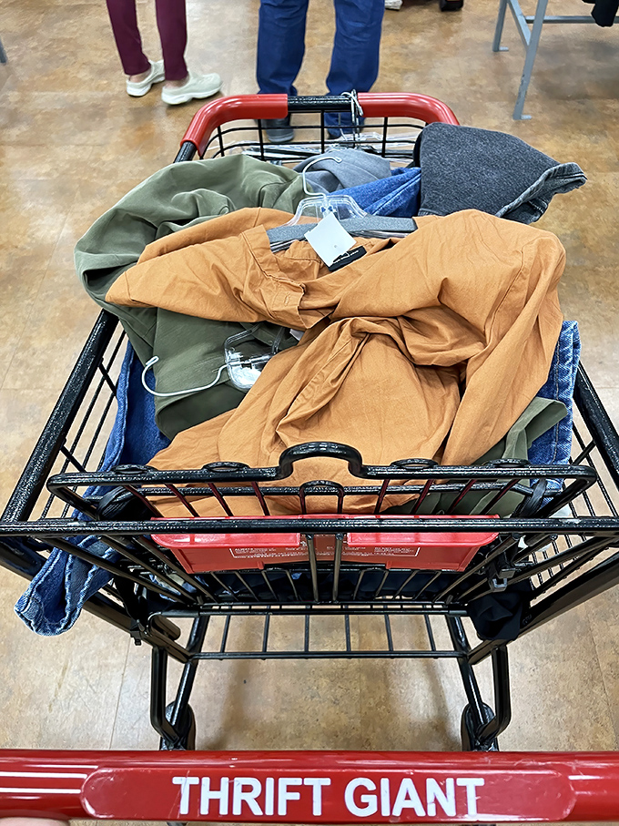 A cart brimming with potential &ndash; earth-toned clothing treasures awaiting their second act. Every item tells a story you get to continue. 