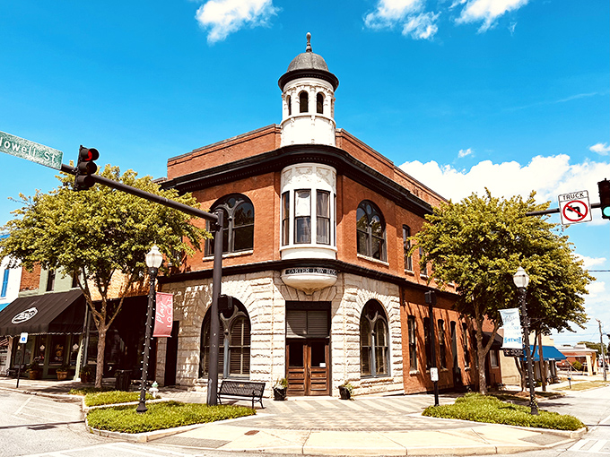 The Carter Law Building stands sentinel at the corner, its cupola keeping watch over downtown like a architectural version of "Law & Order: Small Town Unit."