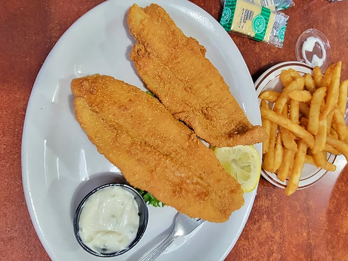 Catfish fillets with a cornmeal crust so perfect it makes you wonder if there's a secret handshake to get the recipe.