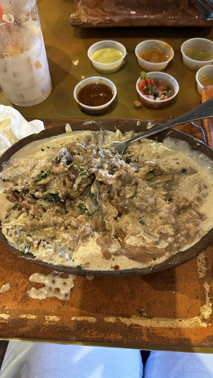 That creamy, bubbling cazuela might look humble, but one bite and you'll understand why people cross state lines for this cheesy, savory masterpiece.