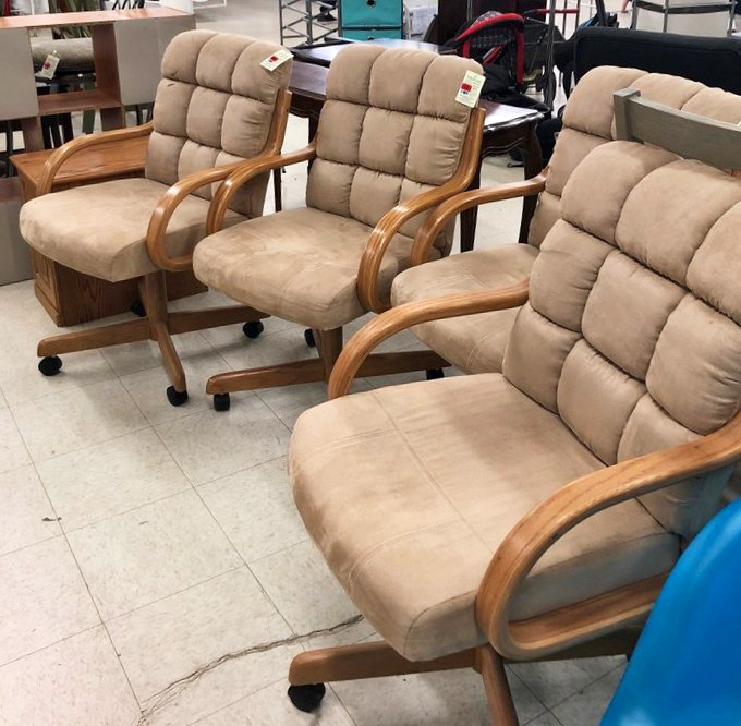 Office chairs with stories to tell, waiting for their next desk assignment. These cushioned commanders have supported countless workdays and now seek new careers.