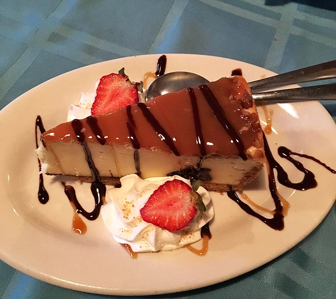 Cheesecake drizzled with chocolate and adorned with strawberries&mdash;because saving room for dessert is always the right decision.