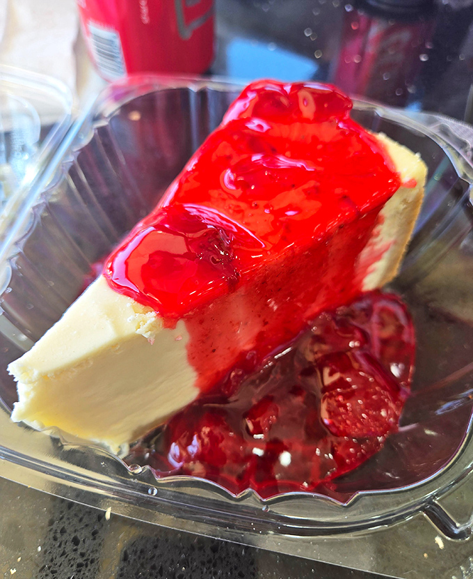 This isn't just cheesecake; it's therapy on a plate, with berry topping as the breakthrough session. 