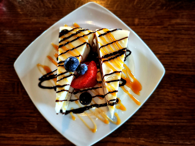 Cheesecake dressed for a night out &ndash; caramel drizzle and chocolate playing across the canvas like Jackson Pollock with a sweeter palette.