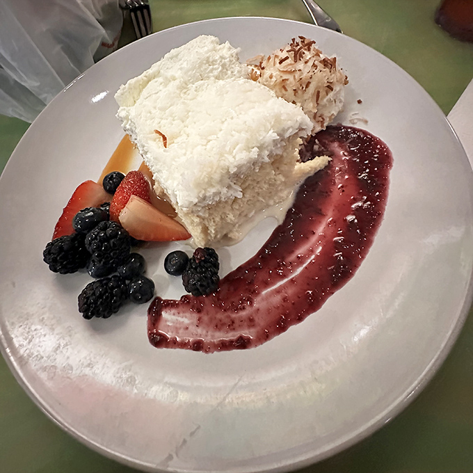Coconut cake so ethereal it deserves its own cloud classification, with berry coulis that adds a perfect tart counterpoint.