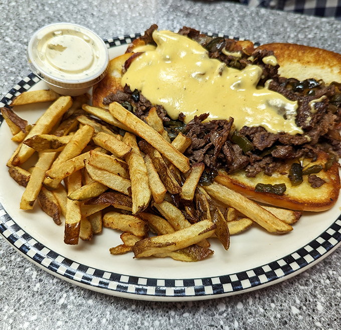 This isn't just a cheesesteak&mdash;it's a masterclass in comfort food architecture, where beef, cheese, and perfectly crisp fries create the holy trinity of satisfaction.