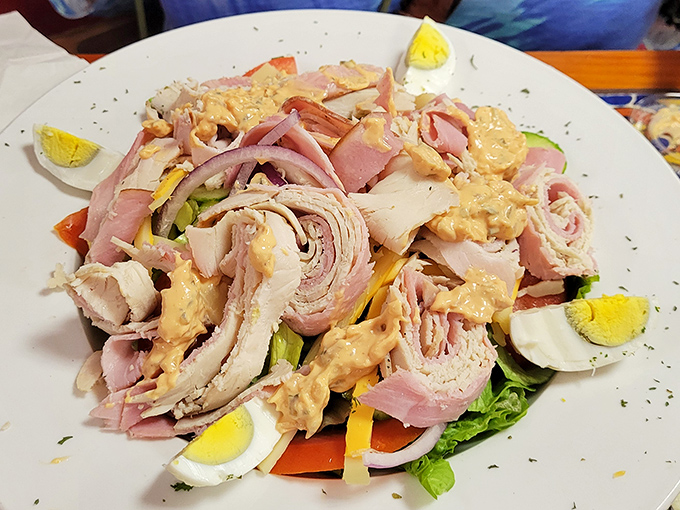 A chef salad that defies the "sad salad" stereotype—layers of fresh ingredients proving healthy doesn't mean sacrificing satisfaction.