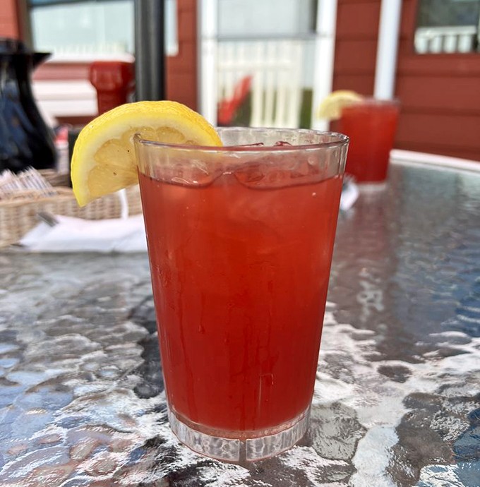 Cherry ade with a lemon wedge&mdash;because sometimes your taste buds deserve a vacation to a place where everything is the color of happiness.