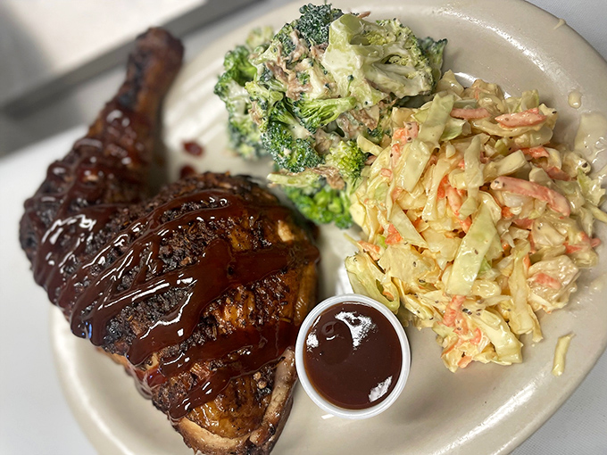 Chicken that proves barbecue isn't just a red meat game &ndash; glistening with sauce and flanked by sides that refuse to be afterthoughts.