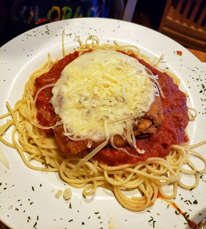Chicken Parmesan that doesn't know the meaning of restraint &ndash; a mountain of melted cheese atop perfectly crisp cutlet and twirled spaghetti.