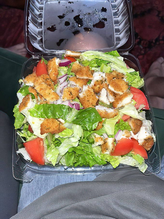 When a chicken salad comes in its own little fortress of flavor, complete with croutons standing guard like delicious sentries.