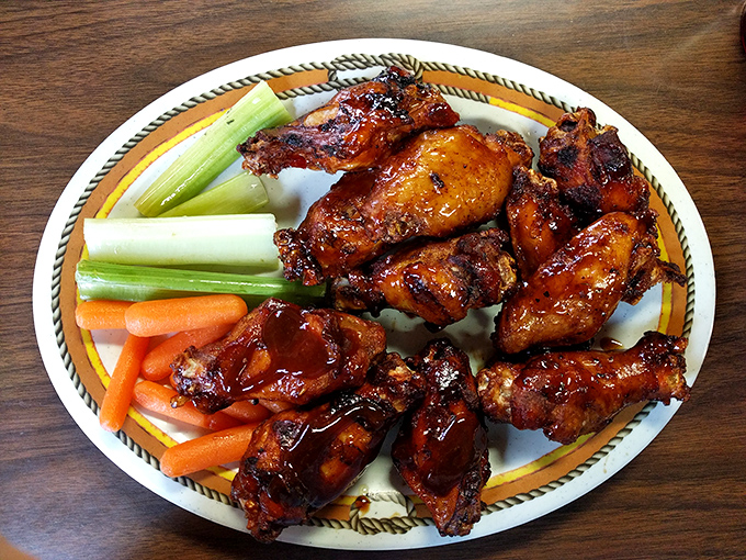 Wings that look like they've been painted with BBQ love &ndash; crispy, sticky, and destined to leave evidence on your shirt as a souvenir.