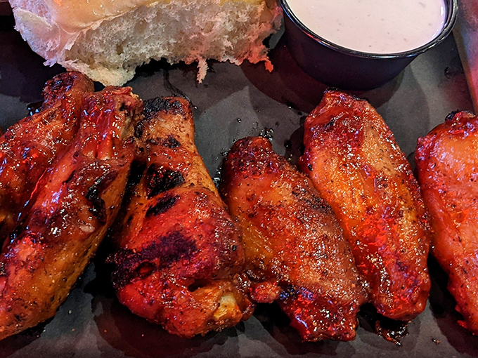 These wings aren't playing games. They've been introduced to smoke, fire, and sauce in a beautiful trifecta of flavor.