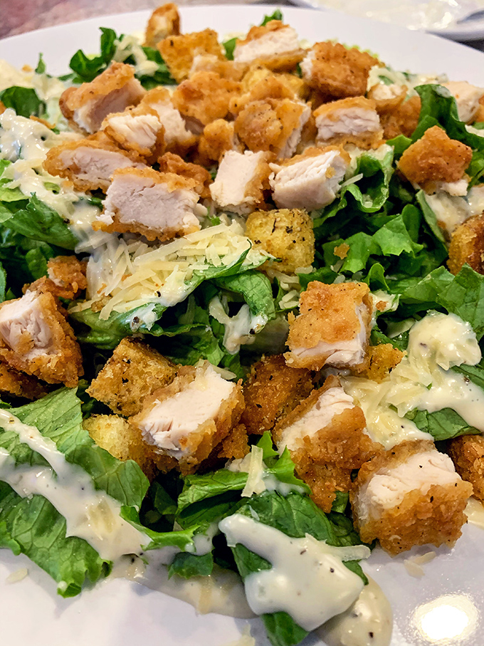 Crispy chicken perched atop fresh greens&mdash;proof that "eating a salad" and "treating yourself" aren't mutually exclusive concepts after all.