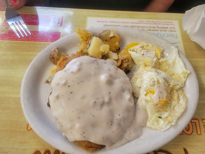 Chicken fried steak that would make a Texan weep with joy, smothered in gravy that's practically a religious experience. Comfort food doctorate awarded!