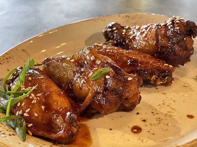 Glistening chicken wings that have clearly earned their PhD in caramelization, with a sticky-sweet glaze that will haunt your taste memories.