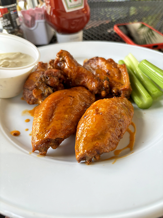 Buffalo wings that strike that perfect balance between spicy kick and savory satisfaction &ndash; napkins required, regrets forbidden.