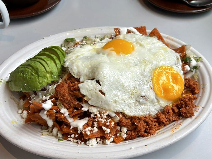 Chilaquiles that bring a fiesta to your morning &ndash; crispy tortillas swimming in sauce, crowned with eggs that add creamy richness.