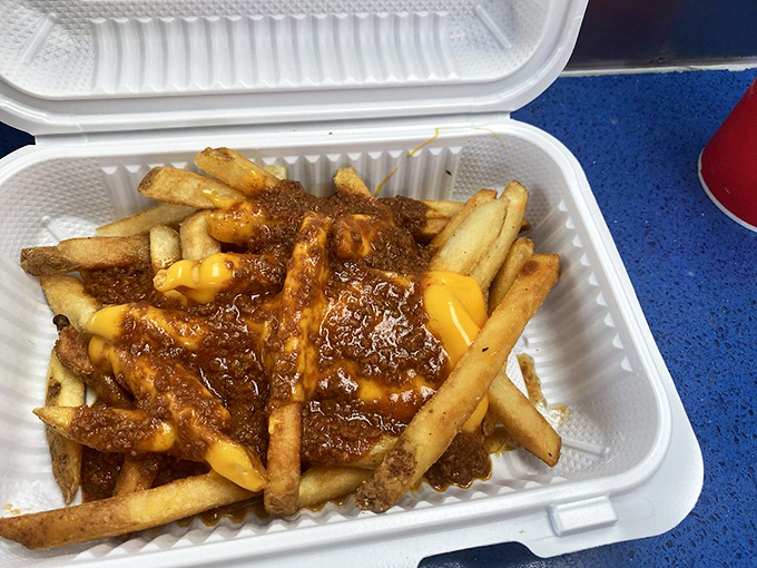 French fries drowning in chili and cheese create the kind of beautiful chaos that makes life worth living.