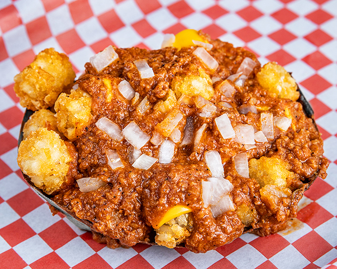 Chili Cheese Tots: Where comfort food goes to level up. That Texas-style chili creates a beautiful mess worth every napkin.