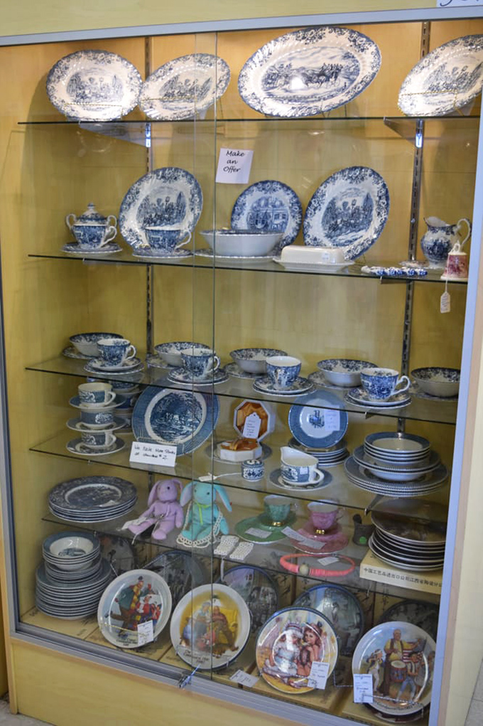 Blue and white chinaware that whispers of Sunday dinners and grandmother's special occasion table settings, all behind pristine glass.