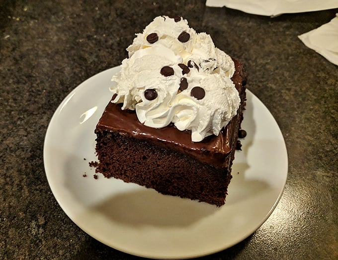 Chocolate cake that doesn't need fancy French names or edible gold leaf&mdash;just honest-to-goodness layers of happiness topped with whipped cream.