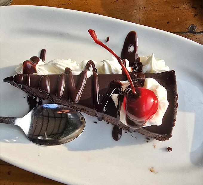 Chocolate cake so decadent it should come with a warning label. That cherry on top isn't garnish&mdash;it's the exclamation point on a dessert manifesto.