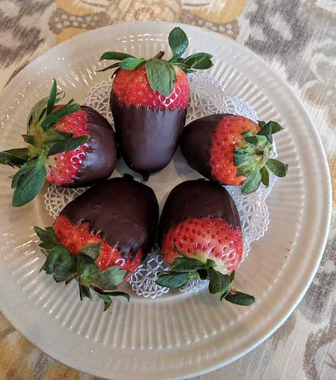 Chocolate-dipped strawberries arranged with military precision. Dessert masquerading as fruit, or fruit dressed up for a fancy night out?