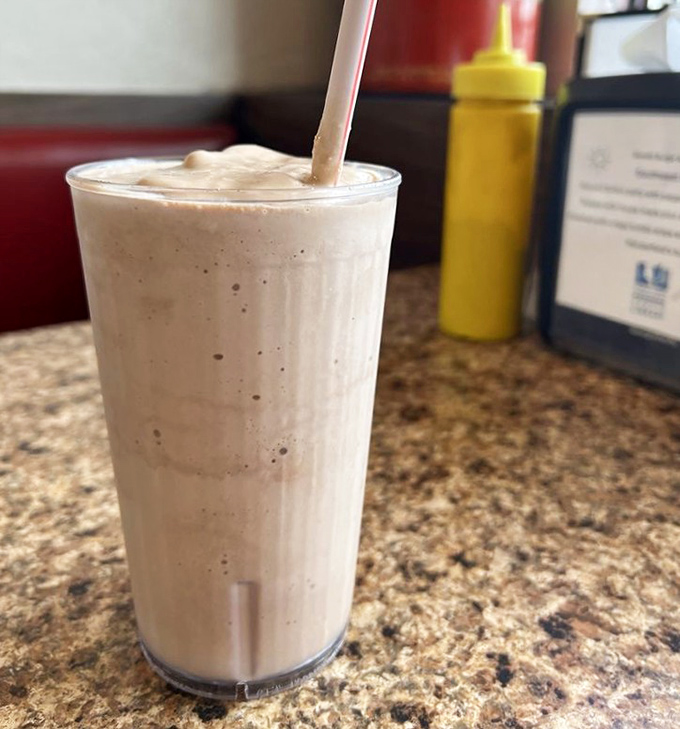 This isn't just a milkshake; it's a creamy time machine to when desserts were simple, substantial, and required both a straw and spoon.