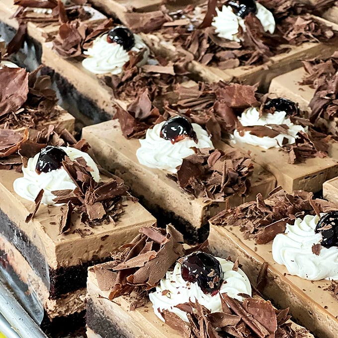 Chocolate mousse squares topped with chocolate shavings and cherries&mdash;because sometimes one form of chocolate simply isn't enough for the situation at hand.